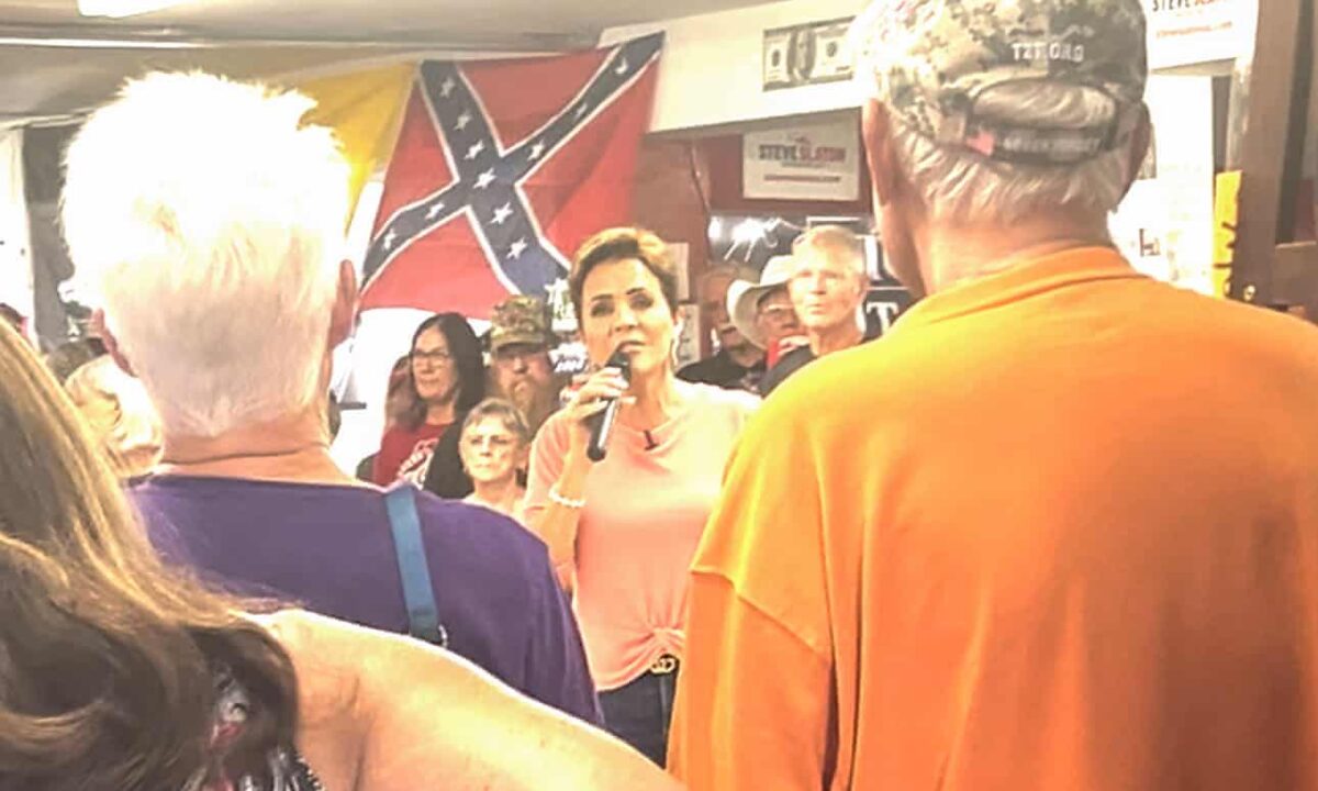 Kari Lake speaks in front of a Confederate flag. - The Mind Shield